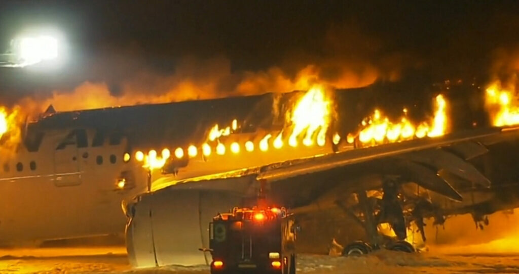 Plane with 379 passengers collides with relief plane; bursts into flames